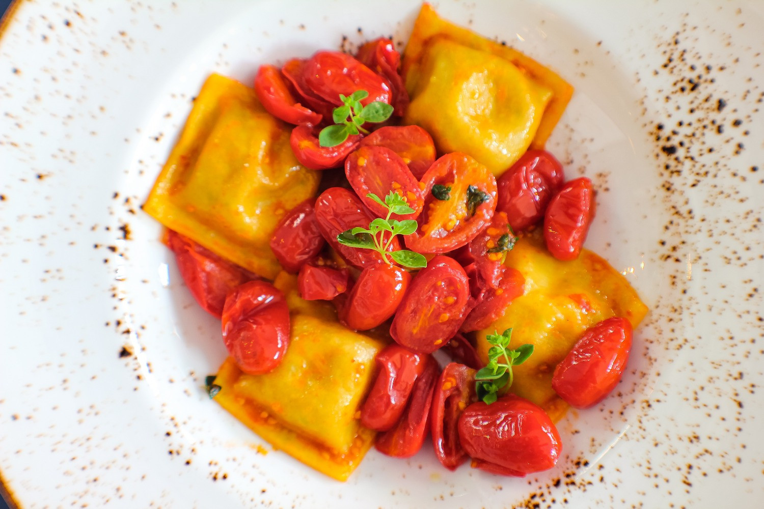 Cod-filled Tortelli with Chickpea Cream and Cherry Tomato Confit