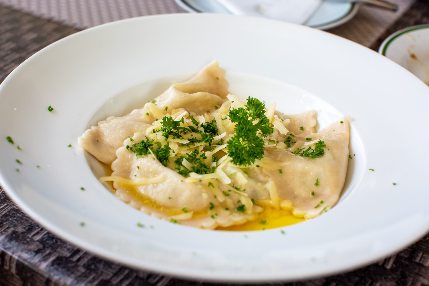 Mezzelune Stuffed with Ricotta and Chives over Creamy Yellow Pepper Sauce